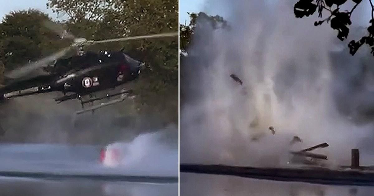 Helicopter tackling forest fire crashes into lake while scooping water ...